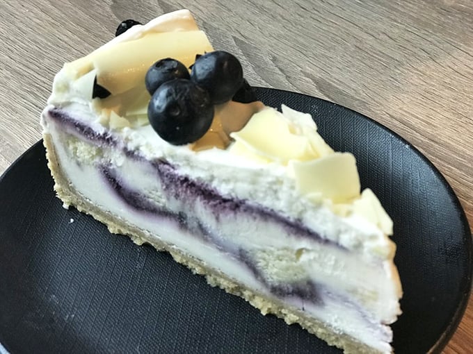 Cheesecake swirled with blueberry that doesn't need a New York accent to prove its authenticity—just one perfect bite.