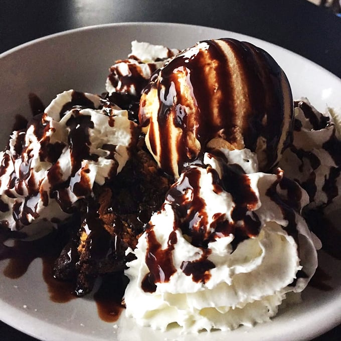 This dessert doesn't just satisfy your sweet tooth – it throws your sweet tooth a parade complete with whipped cream mountains and chocolate sauce rivers.