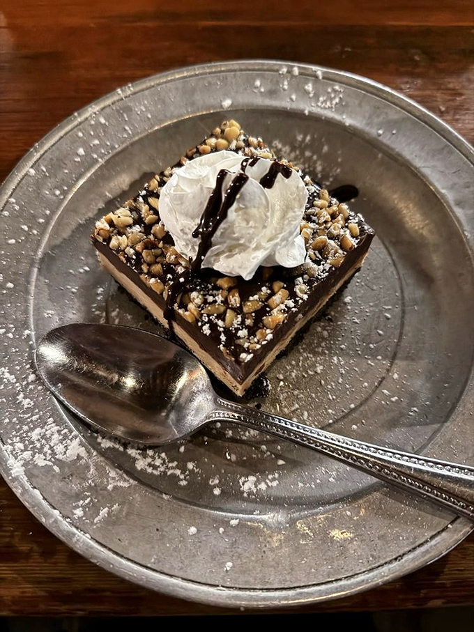 A dessert that understands the importance of textural contrast—creamy, crunchy, and chocolatey in perfect harmony. The whipped cream isn't an afterthought but a necessary final touch.