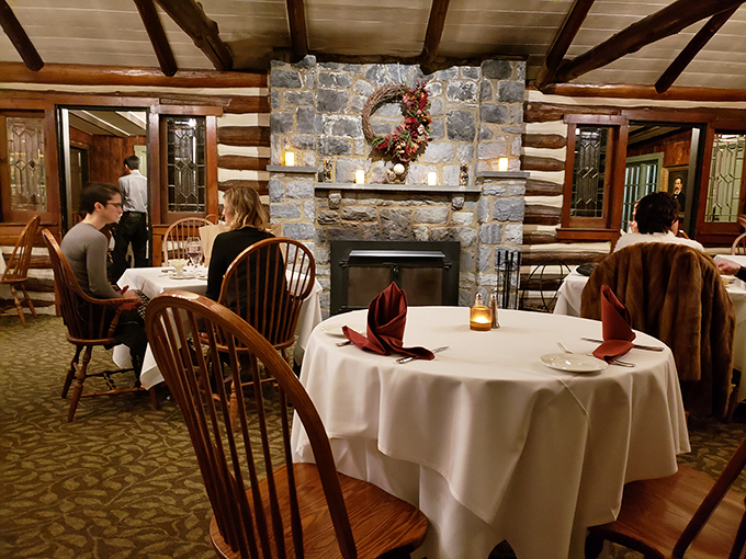 Stone fireplace, white tablecloths, and Windsor chairs—dining rooms like this remind us why restaurants will always beat takeout for special occasions.