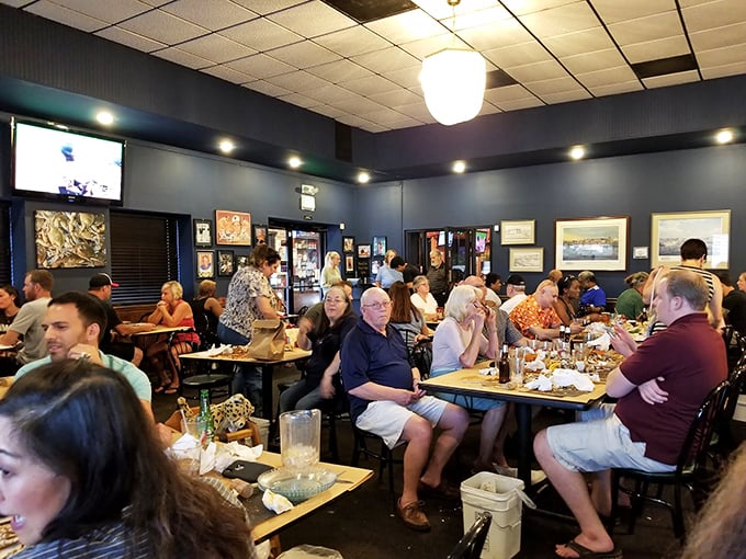 A packed house on a typical evening—where locals and visitors unite in the universal language of "pass the crab mallet."