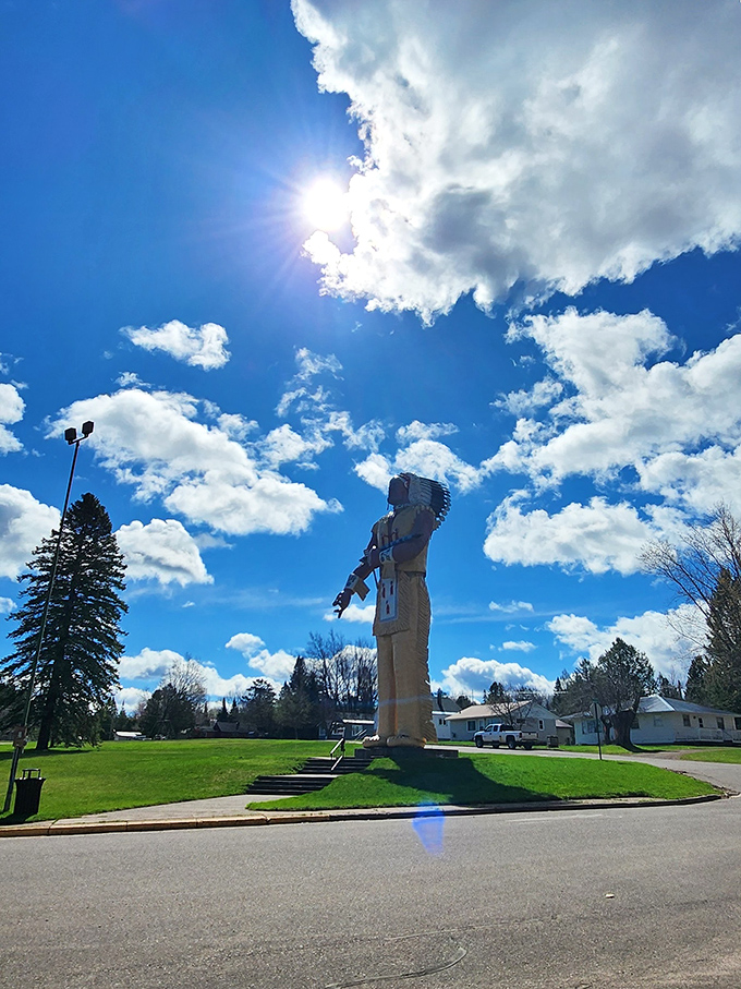 Reaching for the clouds, Hiawatha stands sentinel against Michigan's ever-changing sky—a fiberglass giant who never complains about the weather.