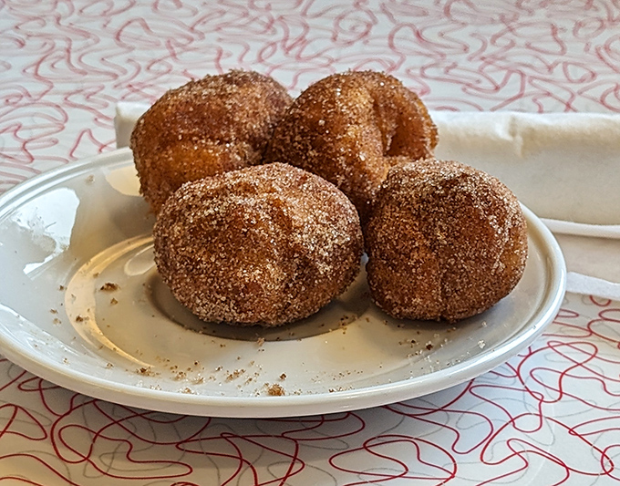 Cinnamon-sugar donut holes that disappear faster than you can say "just one more"—the perfect sweet ending to a diner feast.