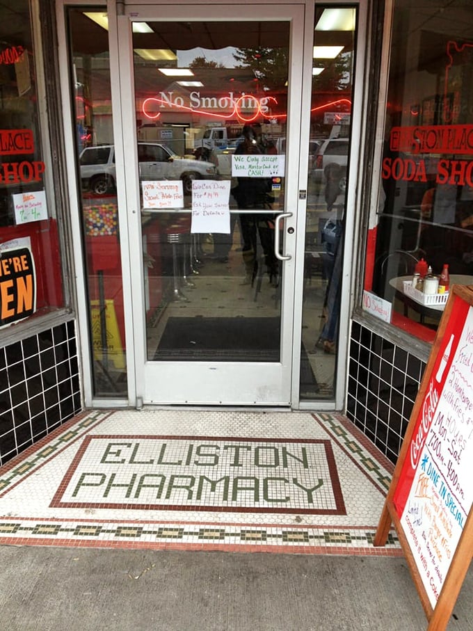 Even the entrance tells a story—original tile spelling "Elliston Pharmacy" reminds us that soda fountains began as the sweet side of medicine shops.