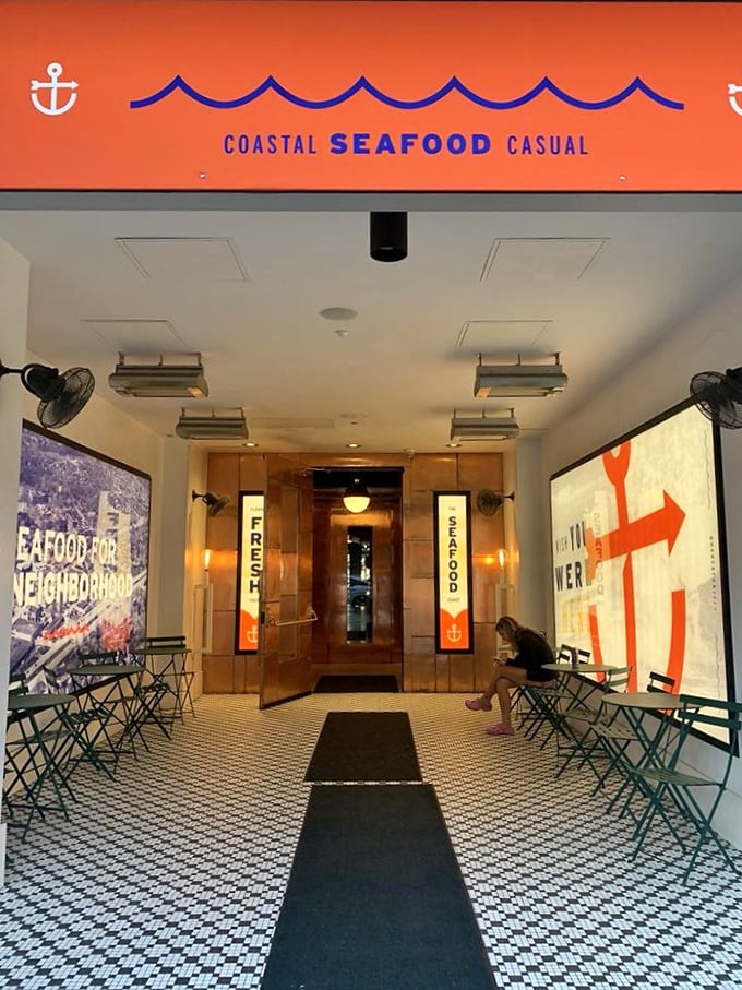 "Coastal Seafood Casual" isn't just a tagline—it's Hazel's promise to Birmingham, spelled out in bright orange above a welcoming entrance.