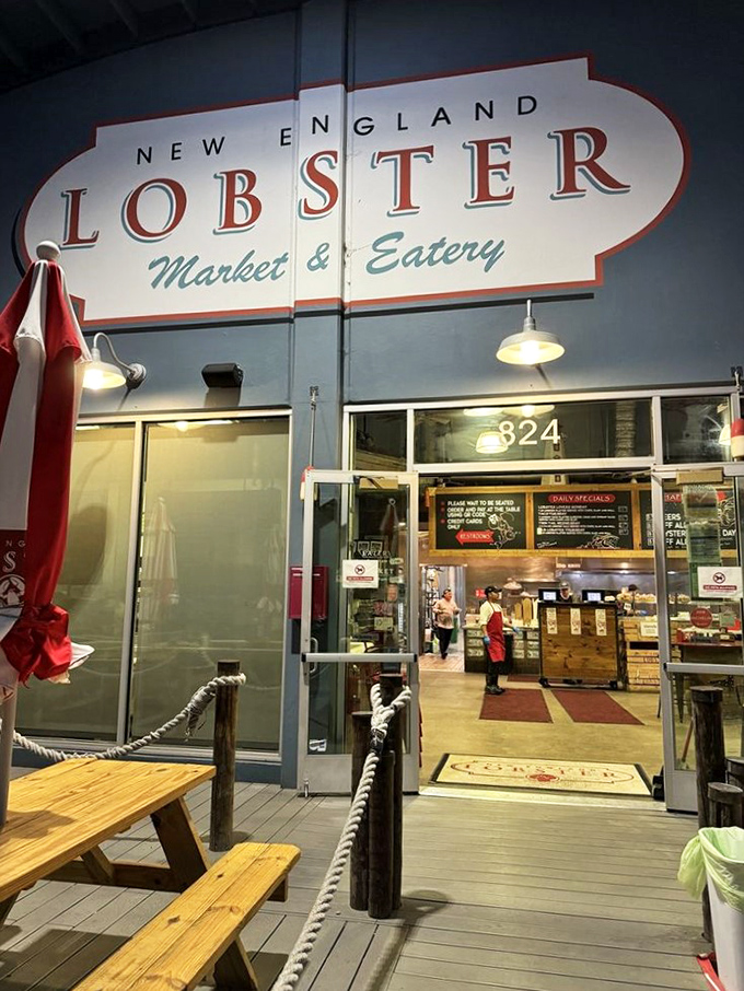 The entrance isn't just a doorway – it's a portal to New England without the airfare. That sign promises what the kitchen delivers.