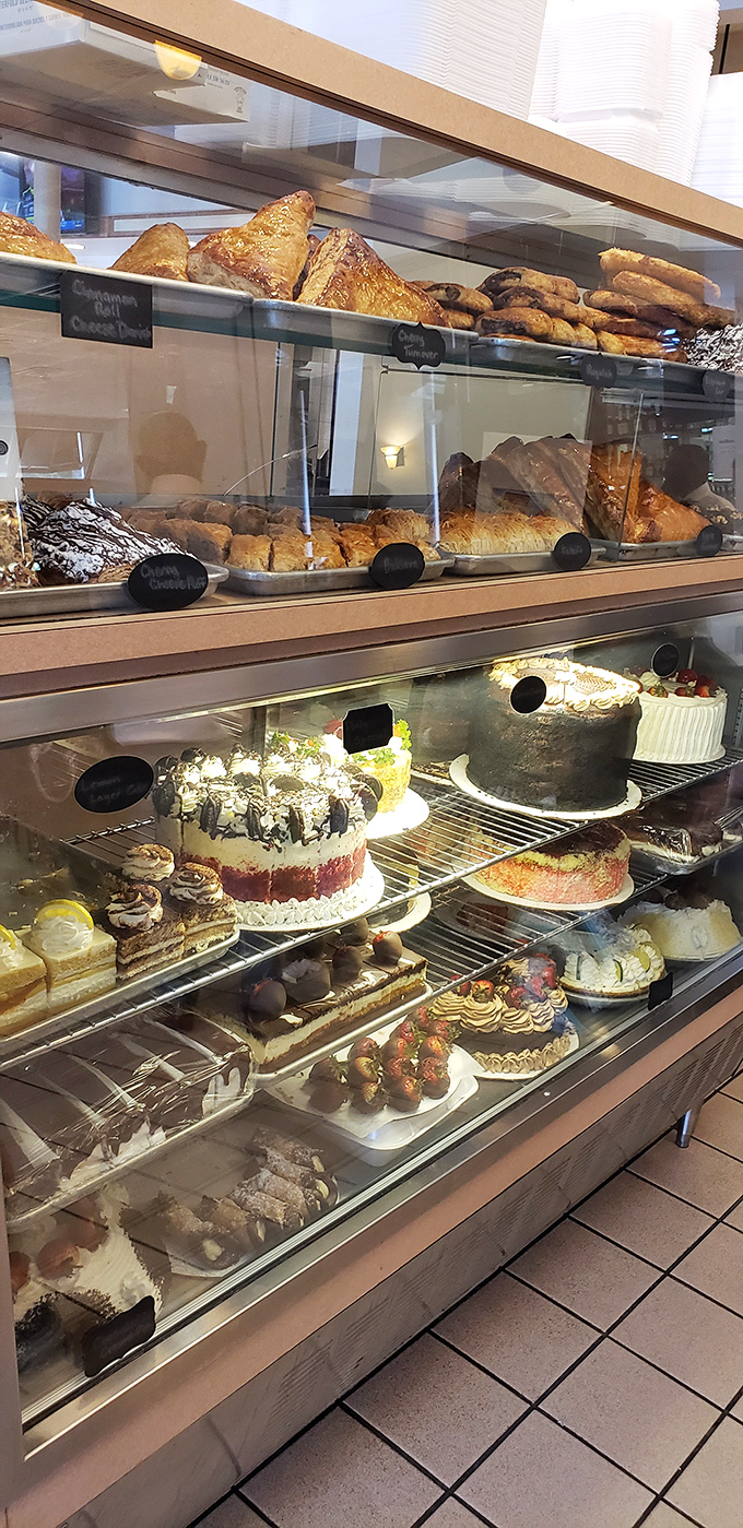 The bakery case—where diet plans go to die and "I'll just have a bite" becomes the lie you tell yourself before ordering a whole cake.
