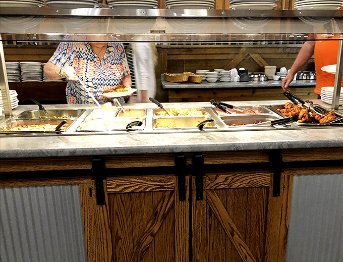 The buffet line – where dreams are made and diets go to die. Notice how everyone takes a little extra when they think no one's watching.
