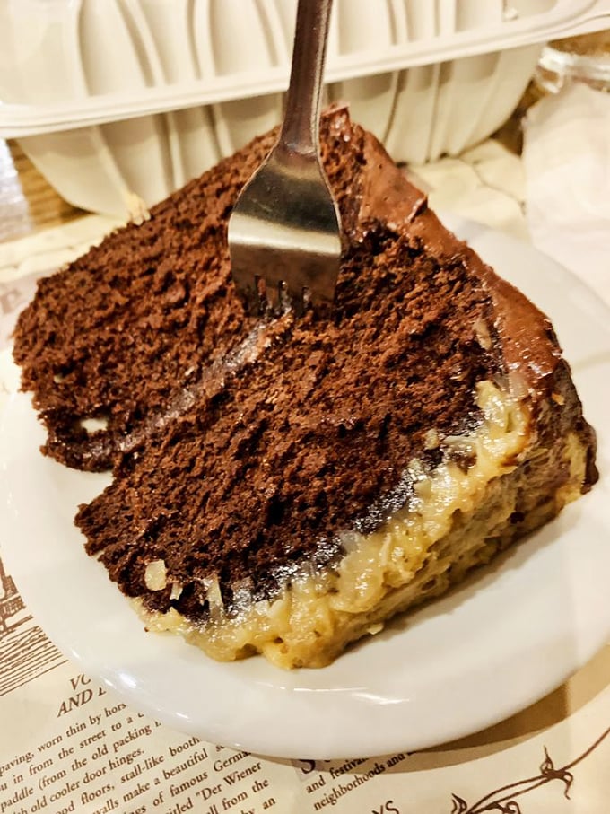 German chocolate cake with that distinctive coconut-pecan frosting layer—proof that Germans understand the importance of proper cake-to-frosting ratios.