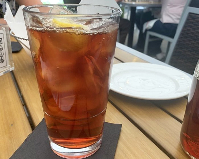 Sometimes the simplest pleasures are the best – a perfectly brewed iced tea with a lemon wedge, waiting to wash down all that comfort food.