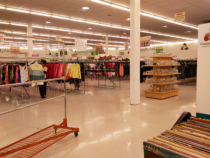 The vast expanse of organized chaos—where clothing racks create neighborhoods of possibility and every aisle promises unexpected discoveries.