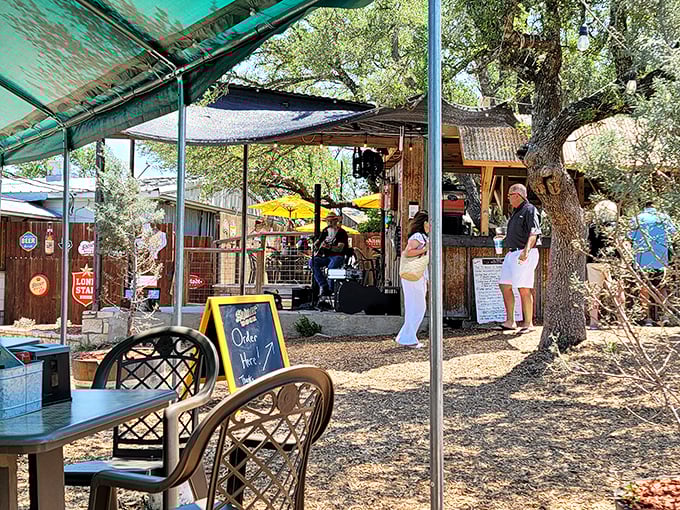Live music under oak trees—because in Texas, feeding your ears is as important as feeding your stomach.