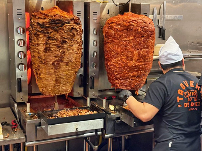 Trompos of spinning meat, hypnotic in their rotation, promising the perfect balance of crispy exterior and succulent interior with every slice.