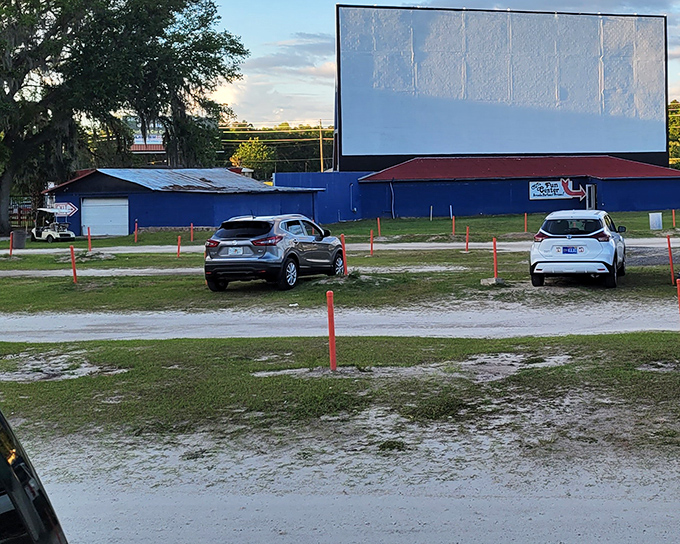 As dusk settles, the screen awaits its transformation from white rectangle to storytelling portal—the calm before the cinematic storm that brings communities together.