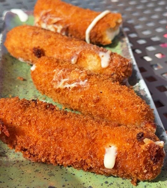 Golden-fried delights that make you forget all about your beach body goals—crispy on the outside, gooey on the inside.