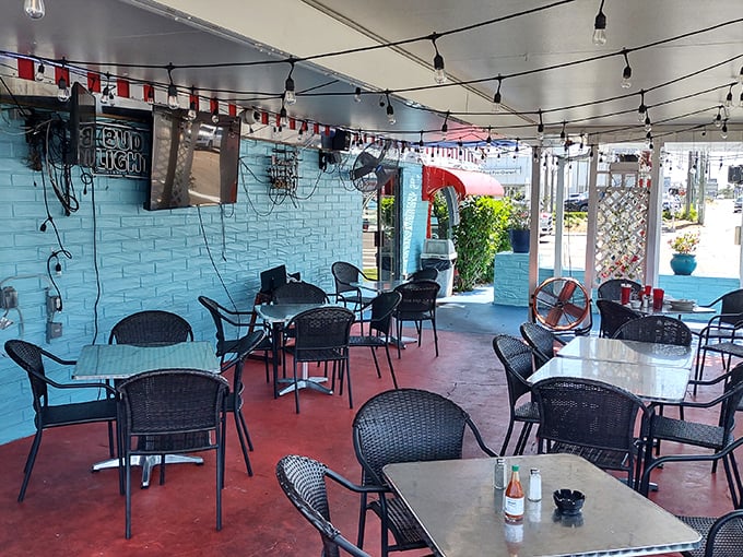 The outdoor seating area offers a breezy Florida alternative to indoor dining, with string lights ready to transform evening meals into something magical.