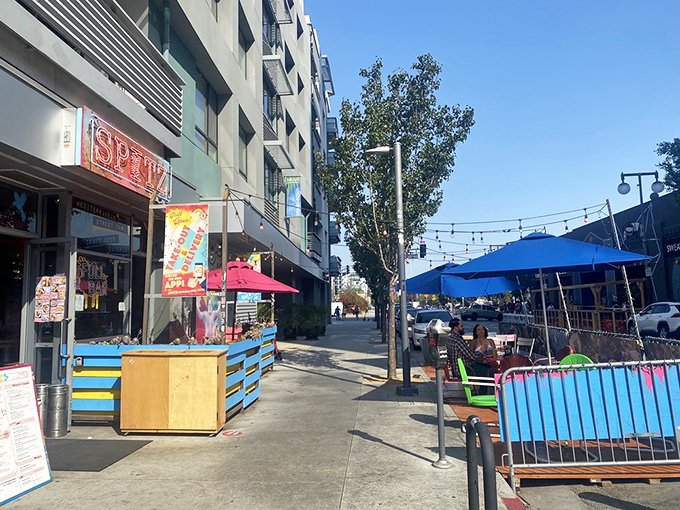 The sidewalk patio – where colorful barriers and string lights transform a slice of Little Tokyo concrete into an urban oasis.