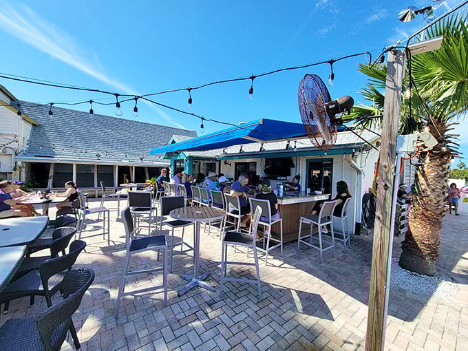 Outdoor seating that reminds you why people move to Florida in the first place – sunshine, palm trees, and drinks within arm's reach.