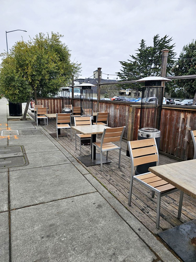 The outdoor patio offers a front-row seat to Pacific Grove's gentle rhythms—perfect for savoring seafood in the coastal breeze.