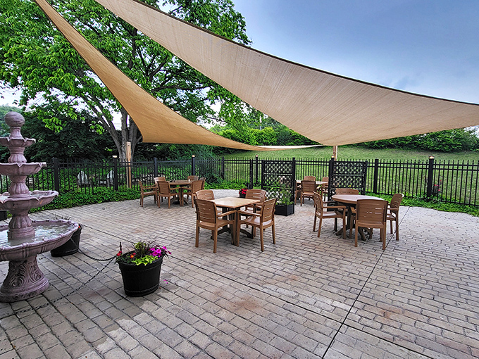 The outdoor seating area offers a peaceful retreat where you can digest both your meal and the historical significance of dining where countless travelers have rested before you.