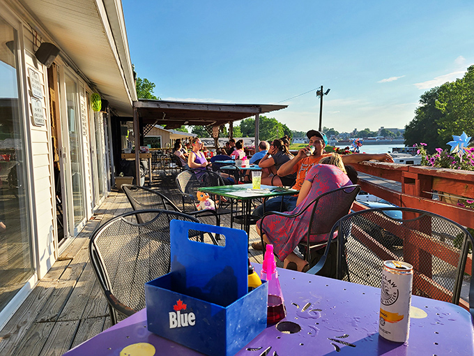 The outdoor deck where summer memories are made. Lake views, cold drinks, and the promise of fried perfection just steps away.