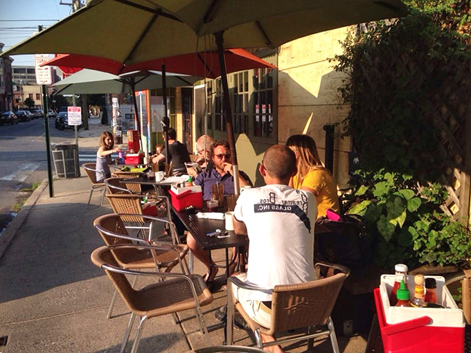 Outdoor seating under colorful umbrellas—where Philadelphia's breakfast enthusiasts gather to enjoy morning masterpieces in the fresh air.