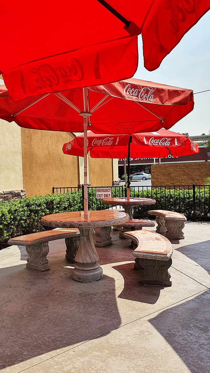 Outdoor seating under Coca-Cola umbrellas—where California sunshine meets diner classics. These stone tables have hosted countless conversations, both profound and delightfully trivial.