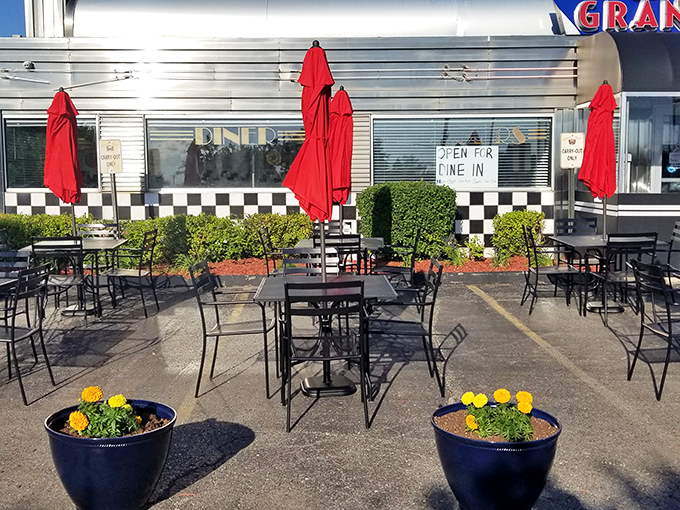 Outdoor seating for when Michigan weather cooperates. Those red umbrellas aren't just for shade—they're beacons calling you home.