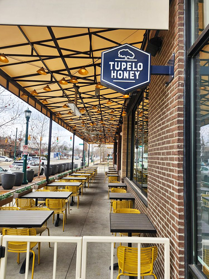 The outdoor seating area with its cheerful yellow chairs isn't just pandemic-friendly—it's the perfect stage for people-watching while savoring Southern delights.