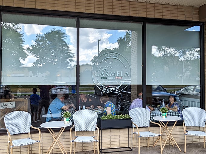 The outdoor café tables aren't just seating—they're front-row tickets to people-watching with the bonus of Italian food delivered straight to your perch.