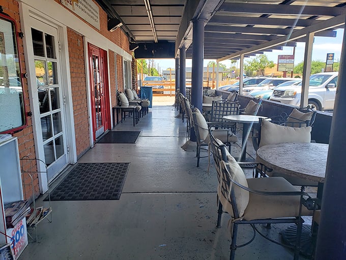 The outdoor seating area awaits your post-BBQ food coma. Those chairs aren't just furniture—they're recovery stations for the gloriously overstuffed.