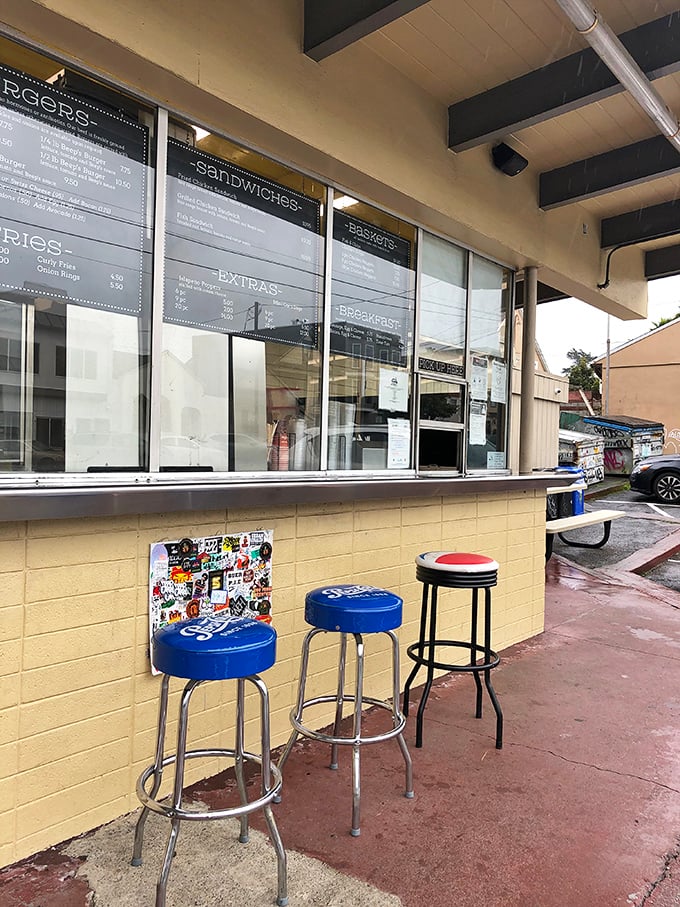 The blue stools and simple counter setup say, "We're focusing on what matters here—and that's what's coming out of the kitchen."
