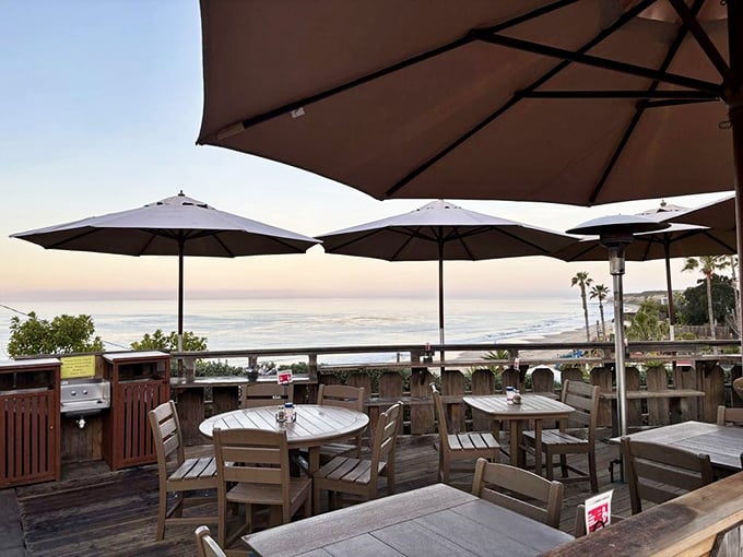 Those umbrellas aren't just shading you from the sun—they're framing million-dollar views that no reservation app could ever secure.