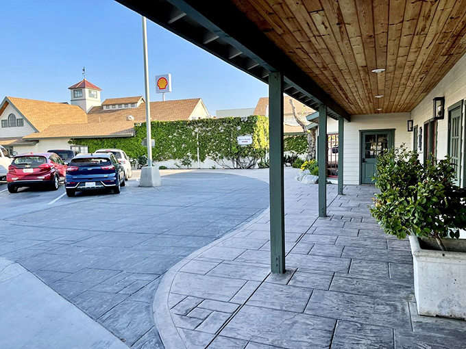 The welcoming entrance path – where countless diners have arrived hungry and departed with the peculiar waddle of the happily overfed.
