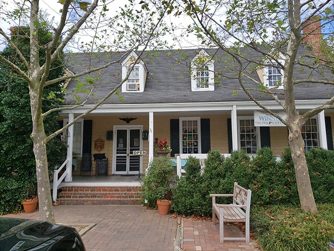 The exterior view that's launched a thousand appetites. This yellow clapboard house with blue shutters isn't just a restaurant—it's a Williamsburg institution