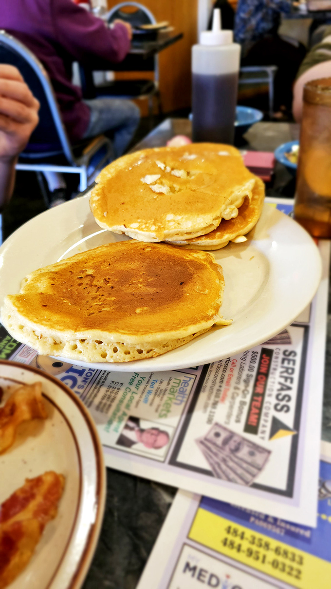 Golden-brown pancakes that make you understand why people write songs about simple pleasures—these aren't just breakfast, they're edible sunshine.