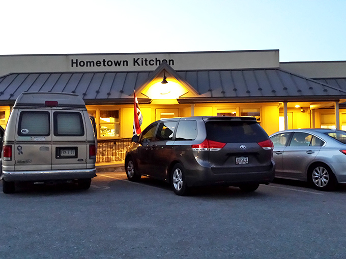 The parking lot at dusk—where anticipation begins and satisfaction ends. These cars represent pilgrims on a quest for something increasingly rare: authenticity on a plate.