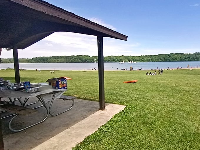 Lakeside picnicking at its finest. That covered shelter transforms ordinary sandwiches into a feast with a million-dollar view.