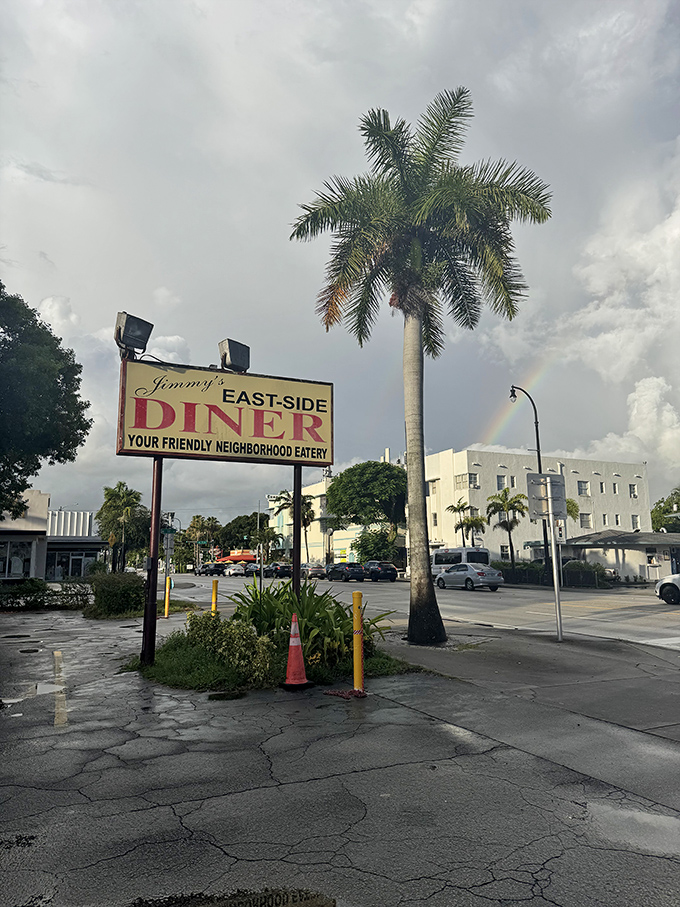 "Your Friendly Neighborhood Eatery"—a sign under Florida skies promising comfort food instead of superhero rescues.