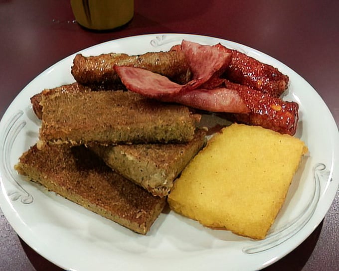 Scrapple and breakfast meats – Pennsylvania Dutch tradition on a plate, proving that nothing honors an animal like using everything.