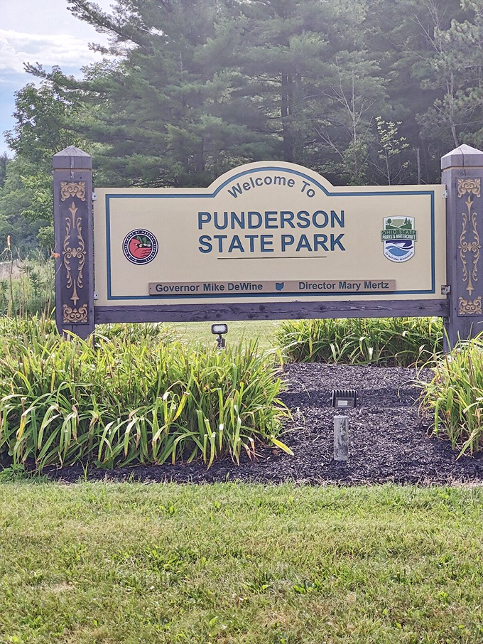 The gateway to adventure – where this unassuming sign marks the boundary between ordinary life and natural wonder.