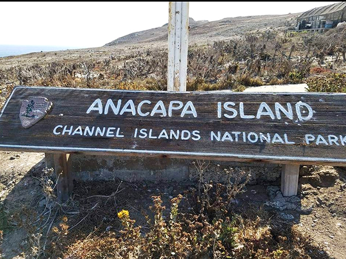 This weathered sign marks your arrival to a place that feels worlds away, despite being just off California's coast.