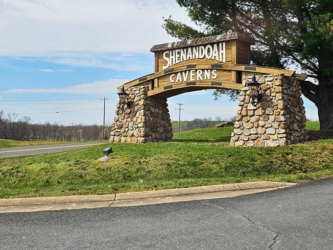 The rustic stone entrance sign promises adventure with old-school charm. Like a treasure map saying "X marks the spot" for underground wonders.