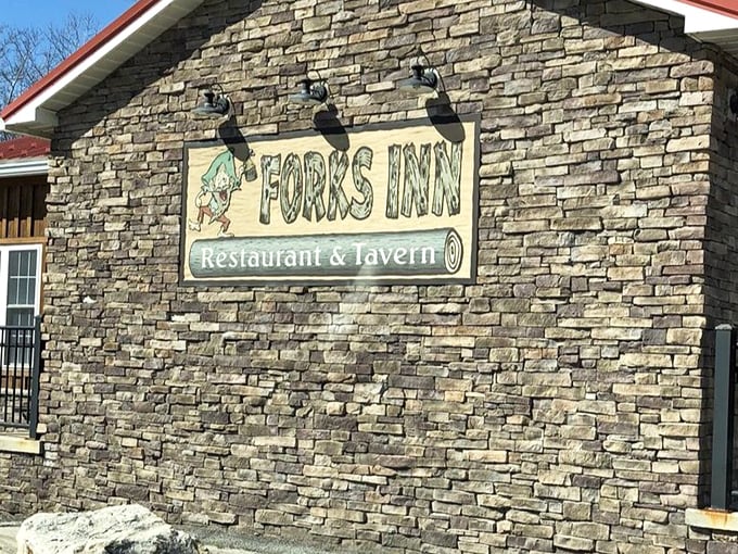 The stone facade and playful signage announce you've arrived somewhere special—a place where hunger ends and satisfaction begins.