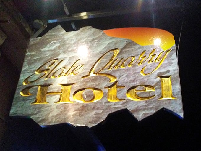 The sign says it all—carved from actual slate, illuminated in gold. A perfect metaphor for this unassuming place that mines culinary gold from traditional techniques and quality ingredients.