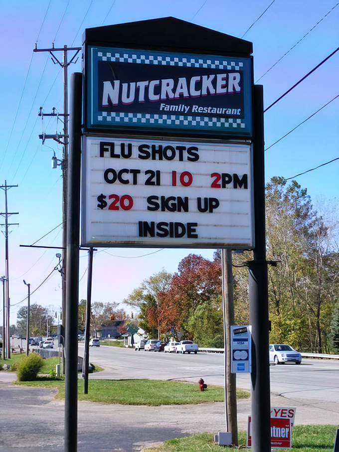 The roadside sign stands as a beacon to hungry travelers—part restaurant announcement, part community bulletin board.