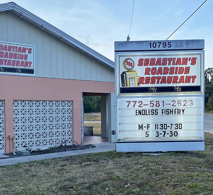 Dawn breaks over Sebastian's pink-hued exterior. The sign promises "Endless Fishfry" – two words that might just be worth planning your week around.
