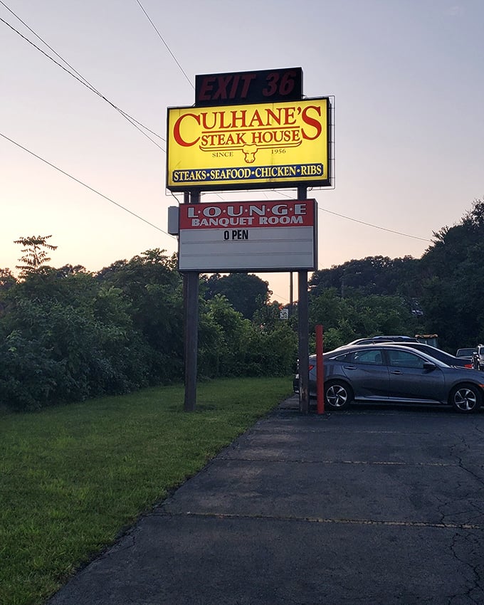 The roadside sign stands like a lighthouse for hungry travelers—Exit 36 might as well be labeled "Salvation.