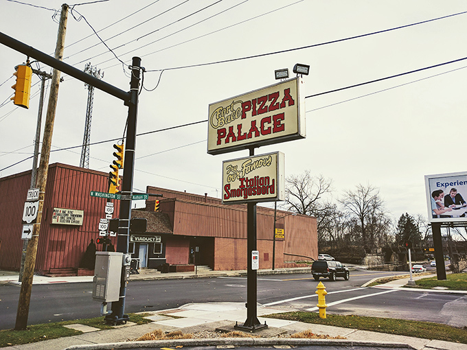Street-side signage announces this local institution where pizza meets pasta in perfect harmony every day.