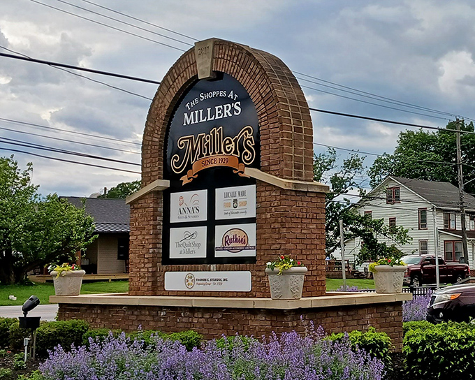 The welcoming brick sign announces you've arrived at Miller's – gateway to a world where calories don't count and stretchy pants are always the right choice.